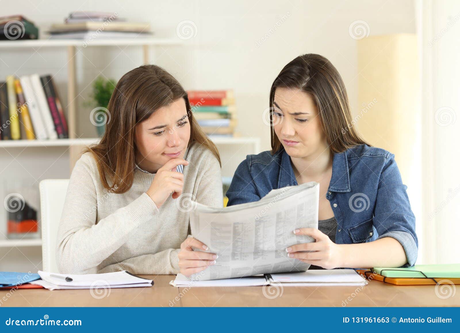 Students Finding Suspicious News in a Newspaper Stock Image - Image of ...
