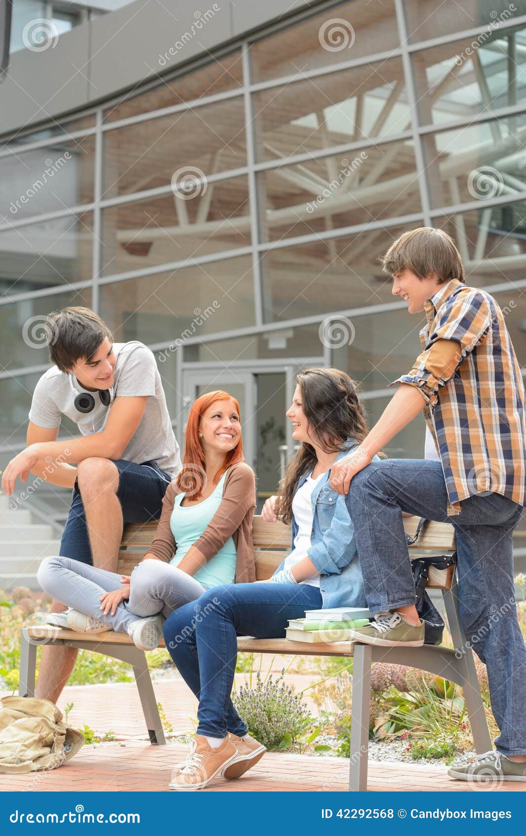 College Students Sitting On Bench