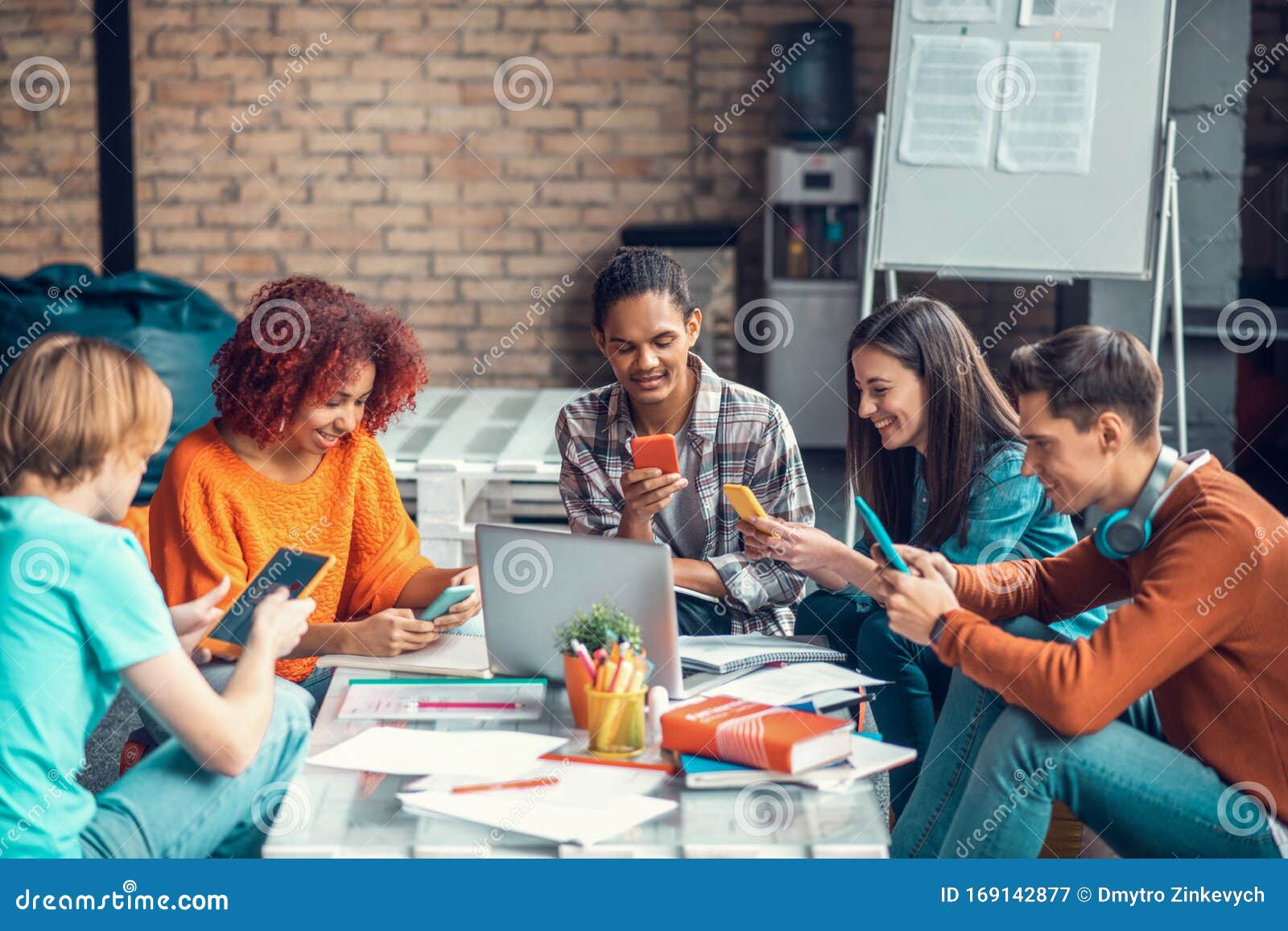 Students Using Their Gadgets while Having Little Break Stock Image ...