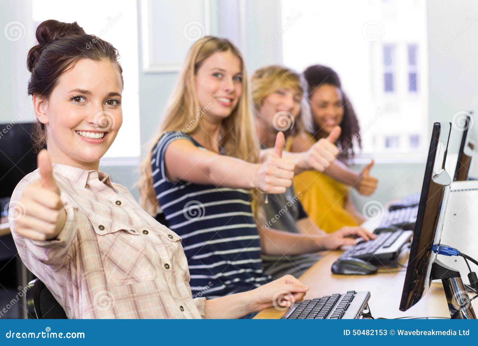 Students Gesturing Thumbs Up in Computer Class Stock Image - Image of ...