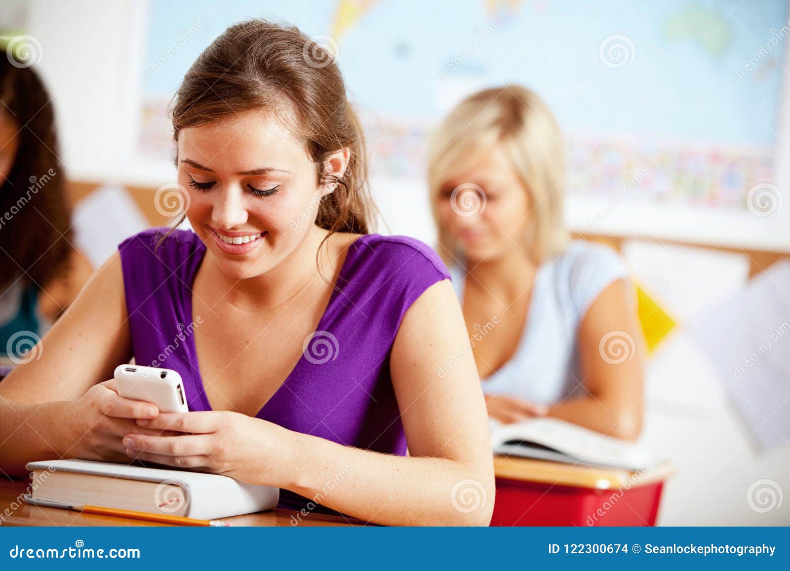 Students: Girl Texts on Cell Phone during Class Stock Photo - Image of ...