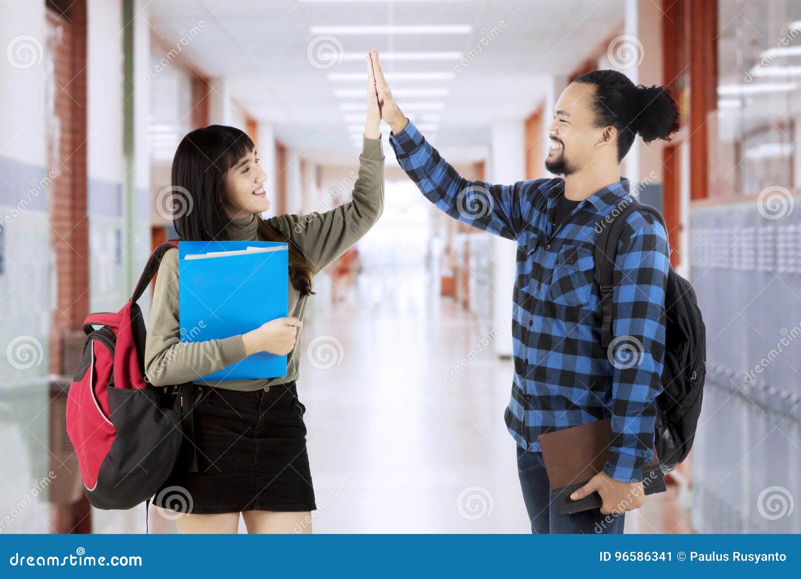 Students Give High Five in School Corridor Stock Image - Image of ...