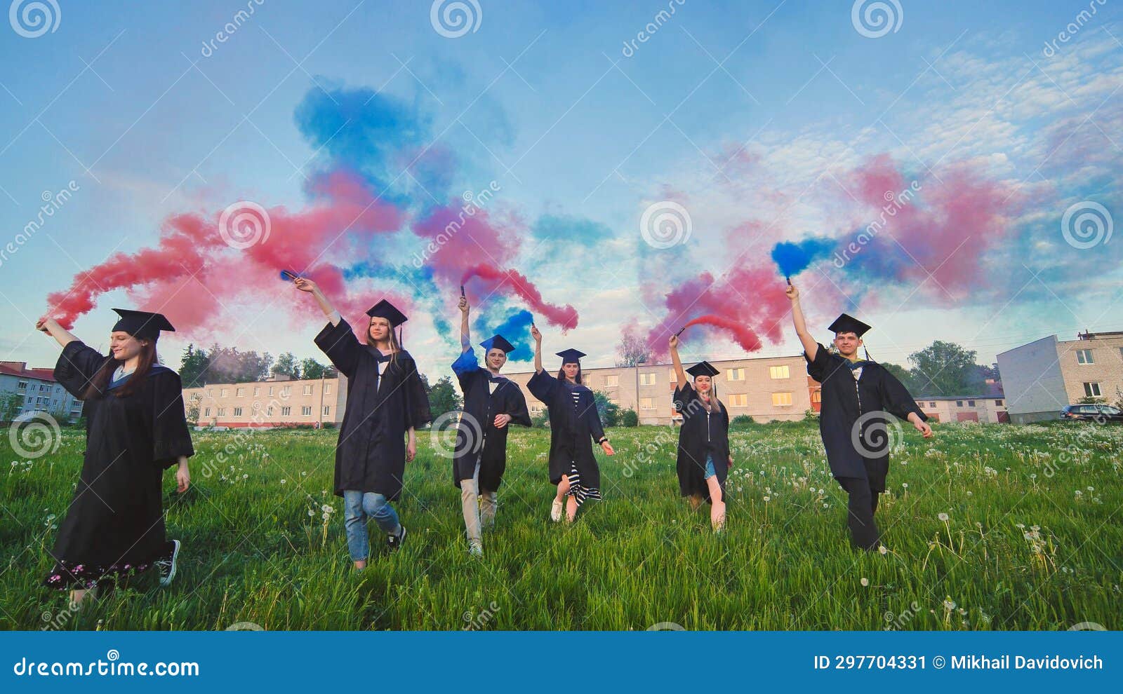 Students Graduate with Colored Smoke Walking through the Meadow in the ...