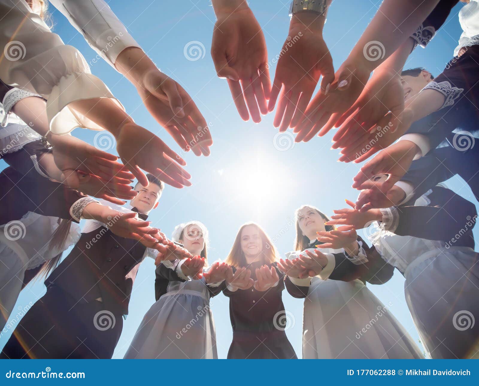 Students Graduates Make the Shape of a Circle from the Palms of Their ...