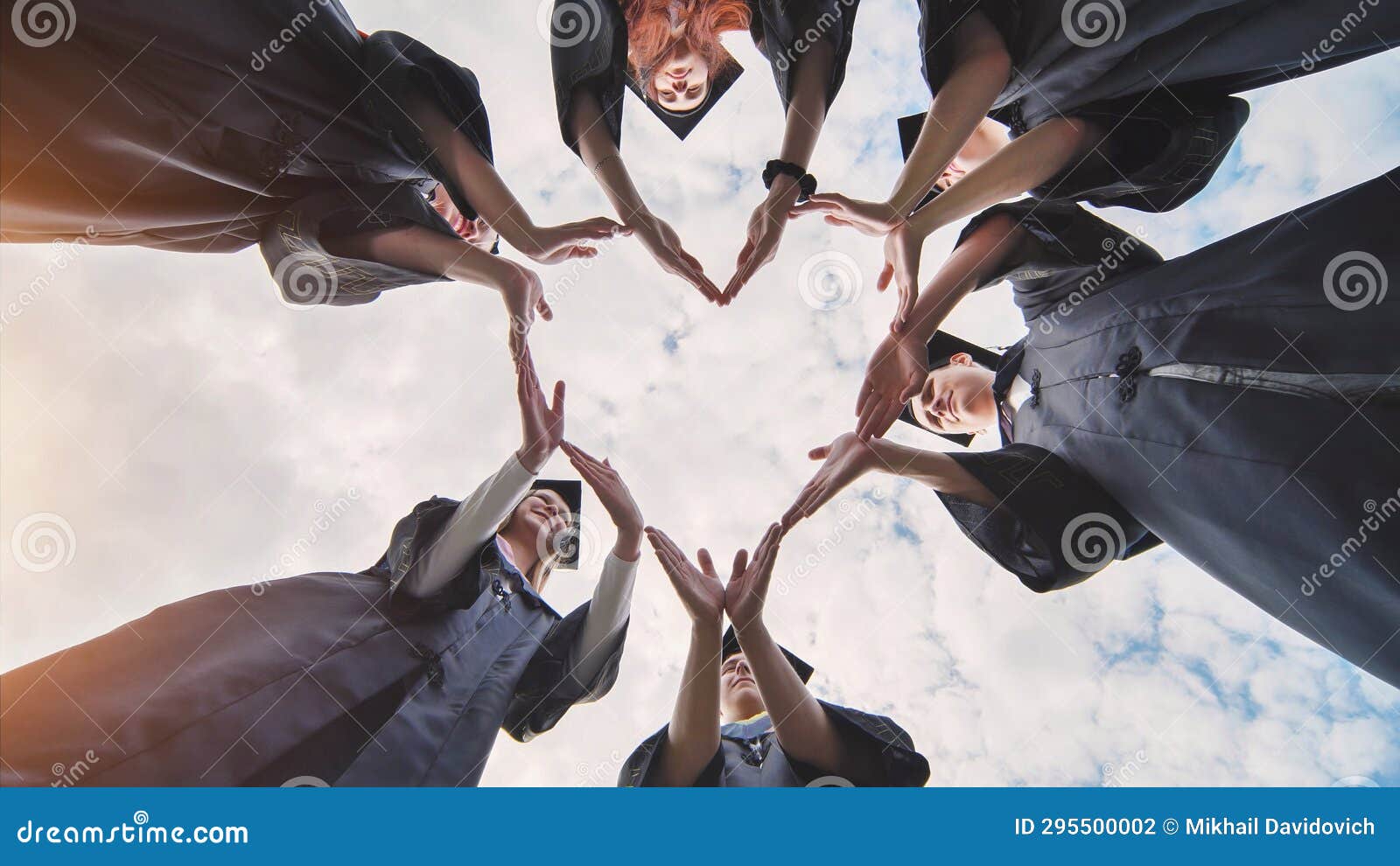 Students Graduating from the College Make a Heart Out of Their Hands ...