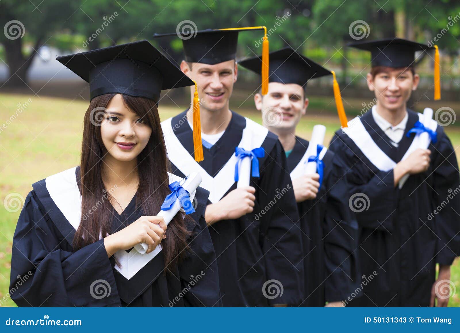 Students in Graduation Gowns on University Campus Stock Image - Image ...