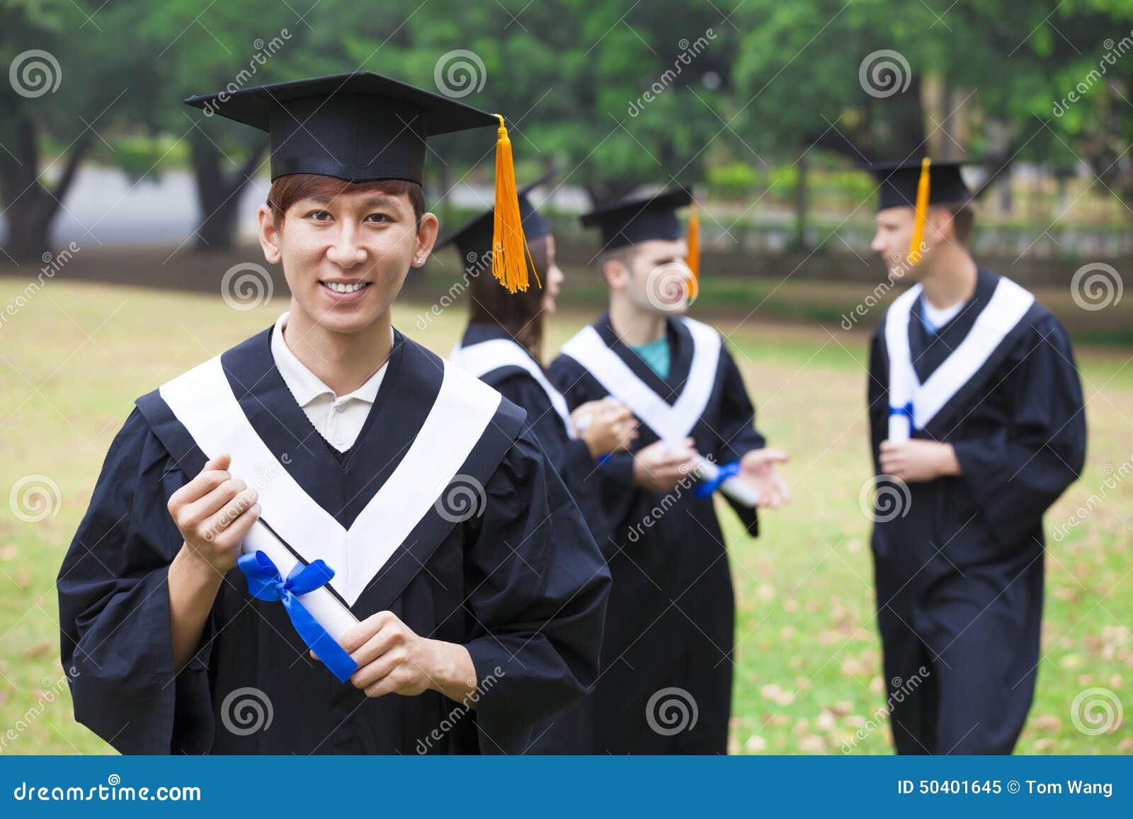 Students in Graduation Gowns on University Campus Stock Image - Image ...
