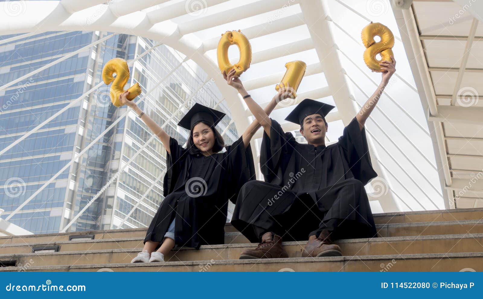 Students in Graduation Suit Sit and Gold Number Balloons 2018 Stock ...