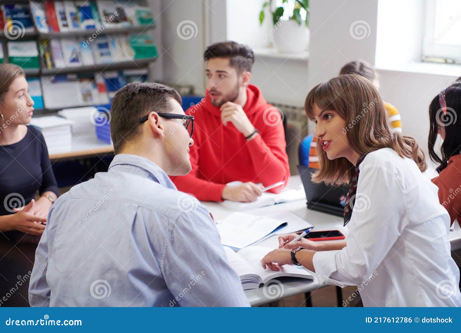 Students Group Working on School Project Together on Tablet Computer at ...
