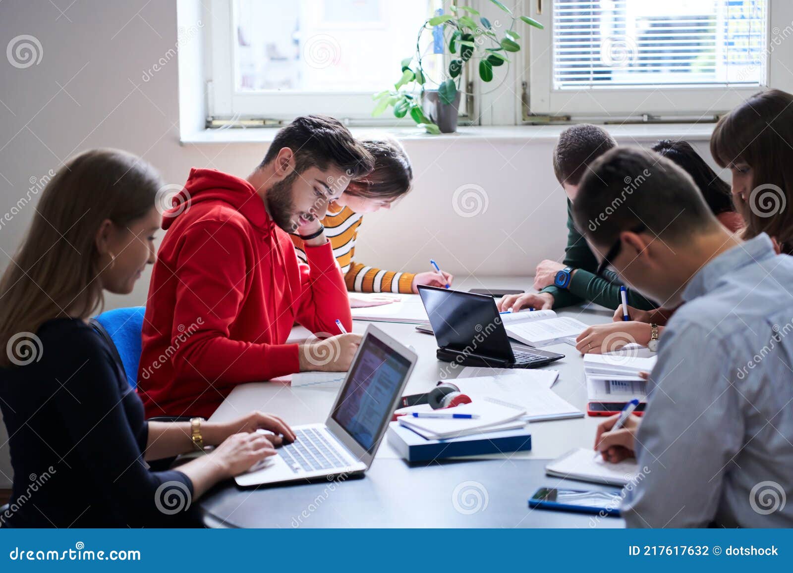 Students Group Working on School Project Together on Tablet Computer at ...