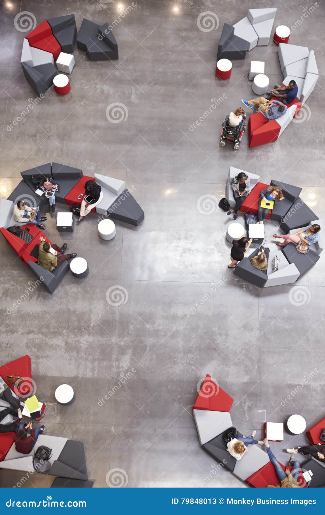 Students Groups Sit in a Modern University Atrium, Vertical Stock Image ...