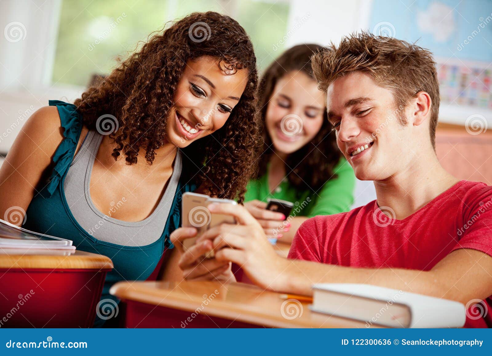 Students: Guy Shows Friend Text Message on Cell Phone Stock Photo ...