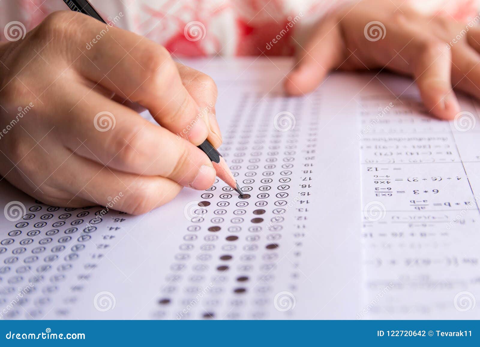 Students Hand Holding Pencil Writing Selected Choice on Answer S Stock ...