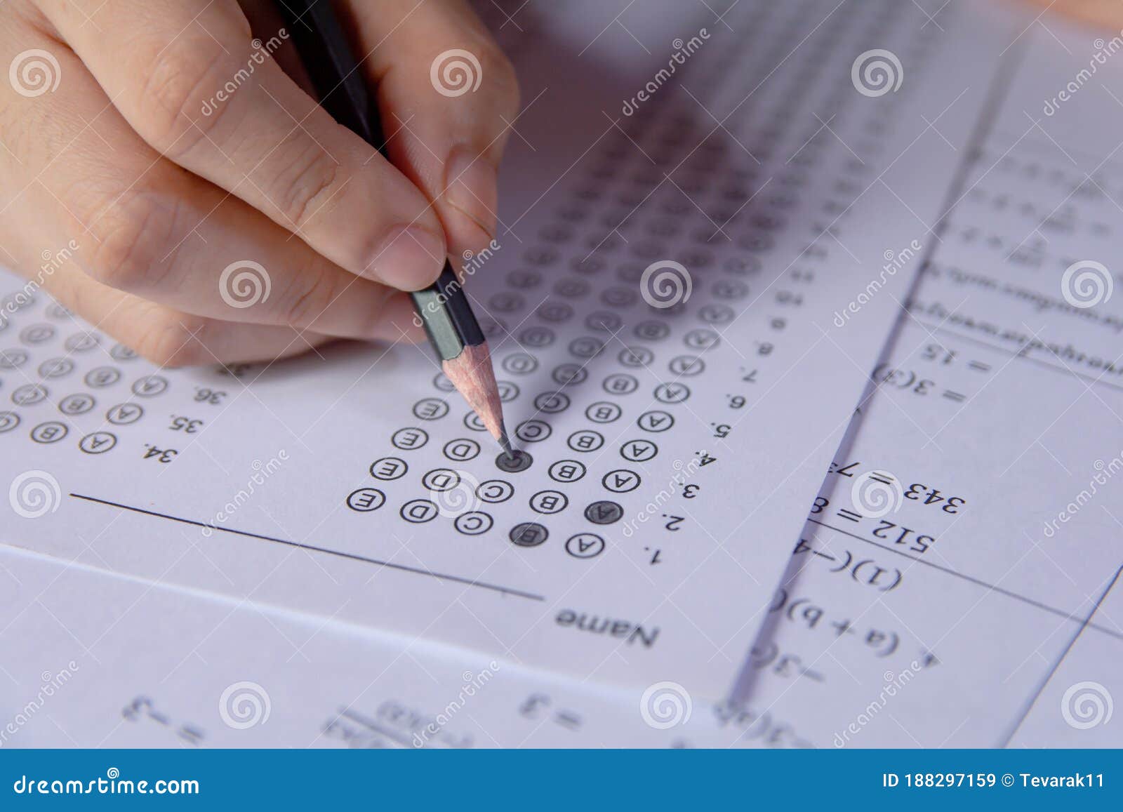 Students Hand Holding Pencil Writing Selected Choice on Answer Sheets ...