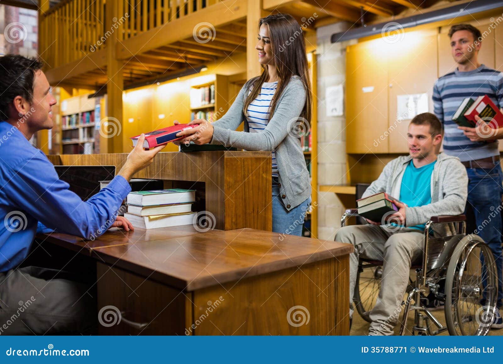 Students with Handicapped Man at the Library Counter Stock Image ...