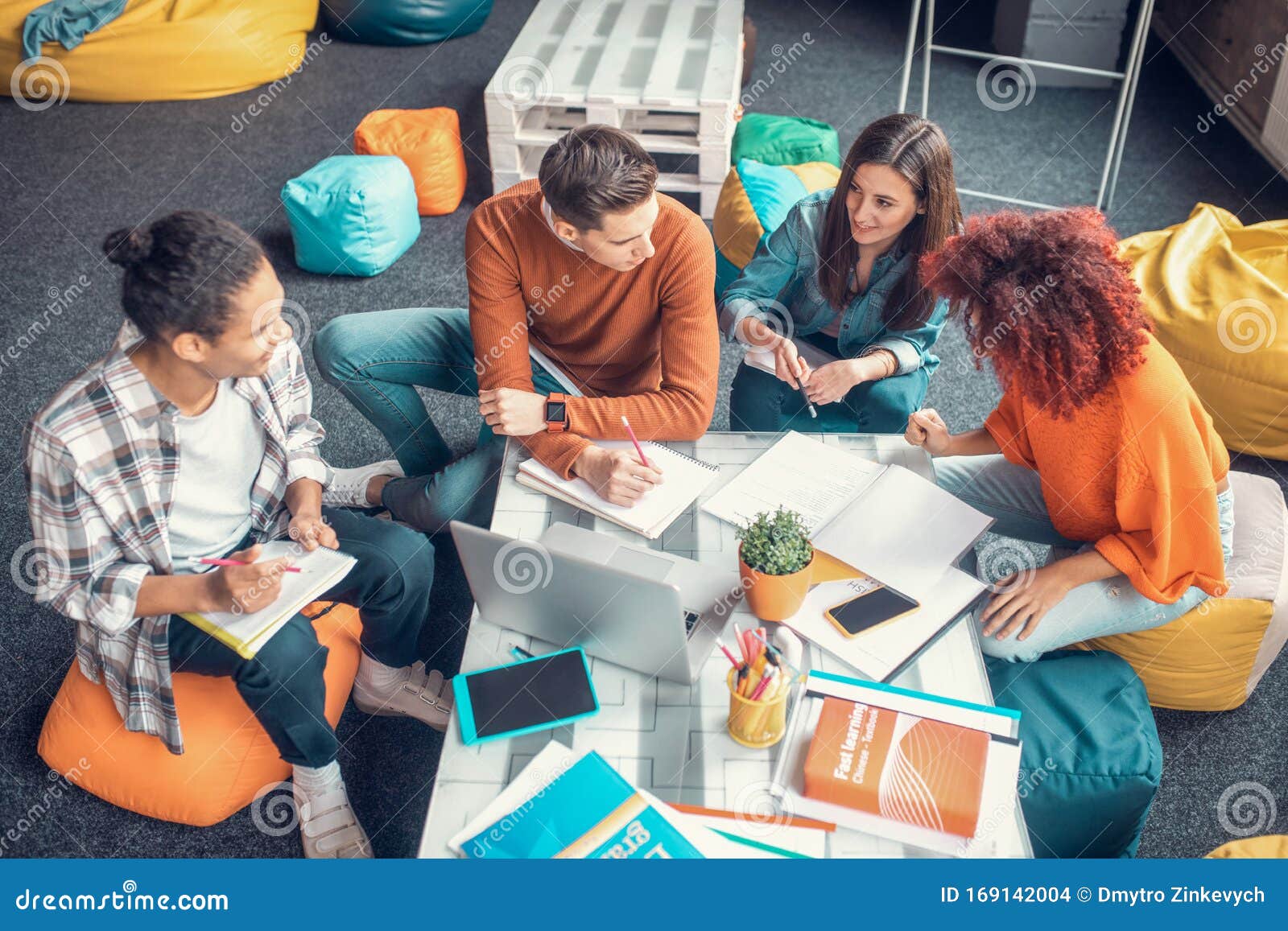 Students Having Group Discussion while Preparing for Group Project ...