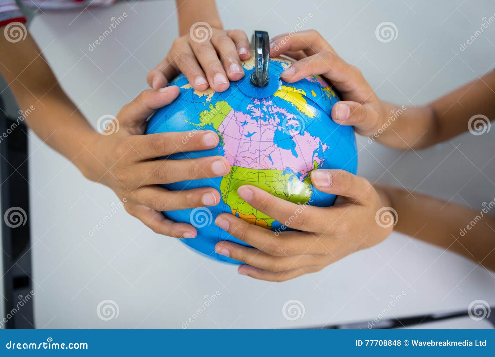 Students Holding Globe in Classroom Stock Photo - Image of finger ...