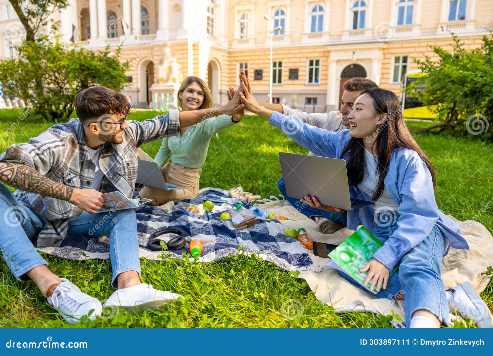 Students Holding Hands while Sitting on Grass Working Together on ...