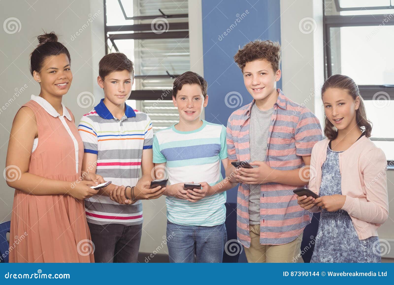 Students Holding Mobile Phone in Classroom Stock Photo - Image of ...