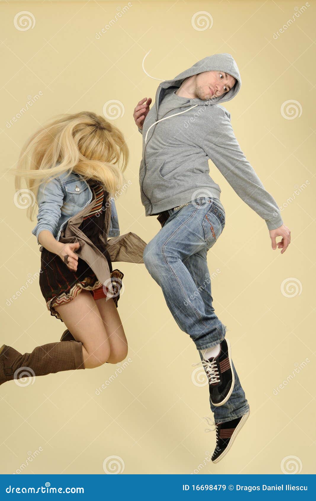 Students jumping together stock image. Image of studio - 16698479