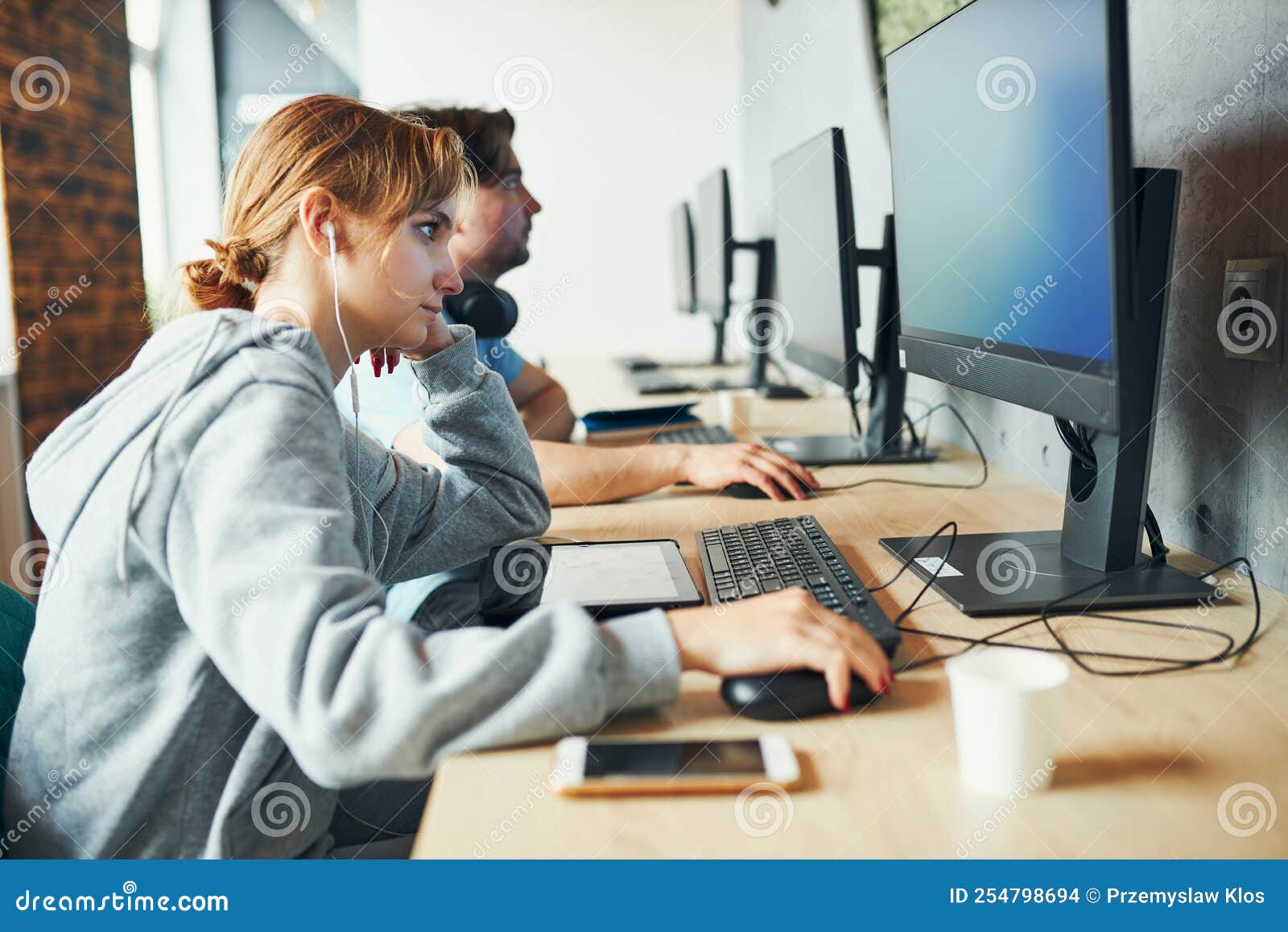Students Learning in Computer Classroom. Young Man Preparing for Test ...