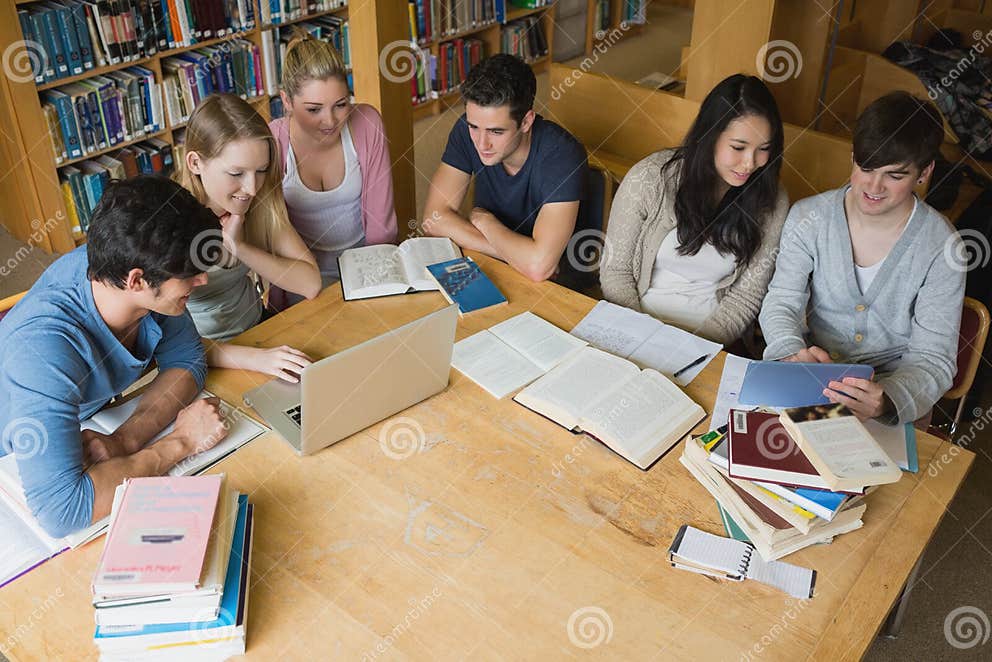 Students Learning with Laptop and Tablet in a Library Stock Image ...