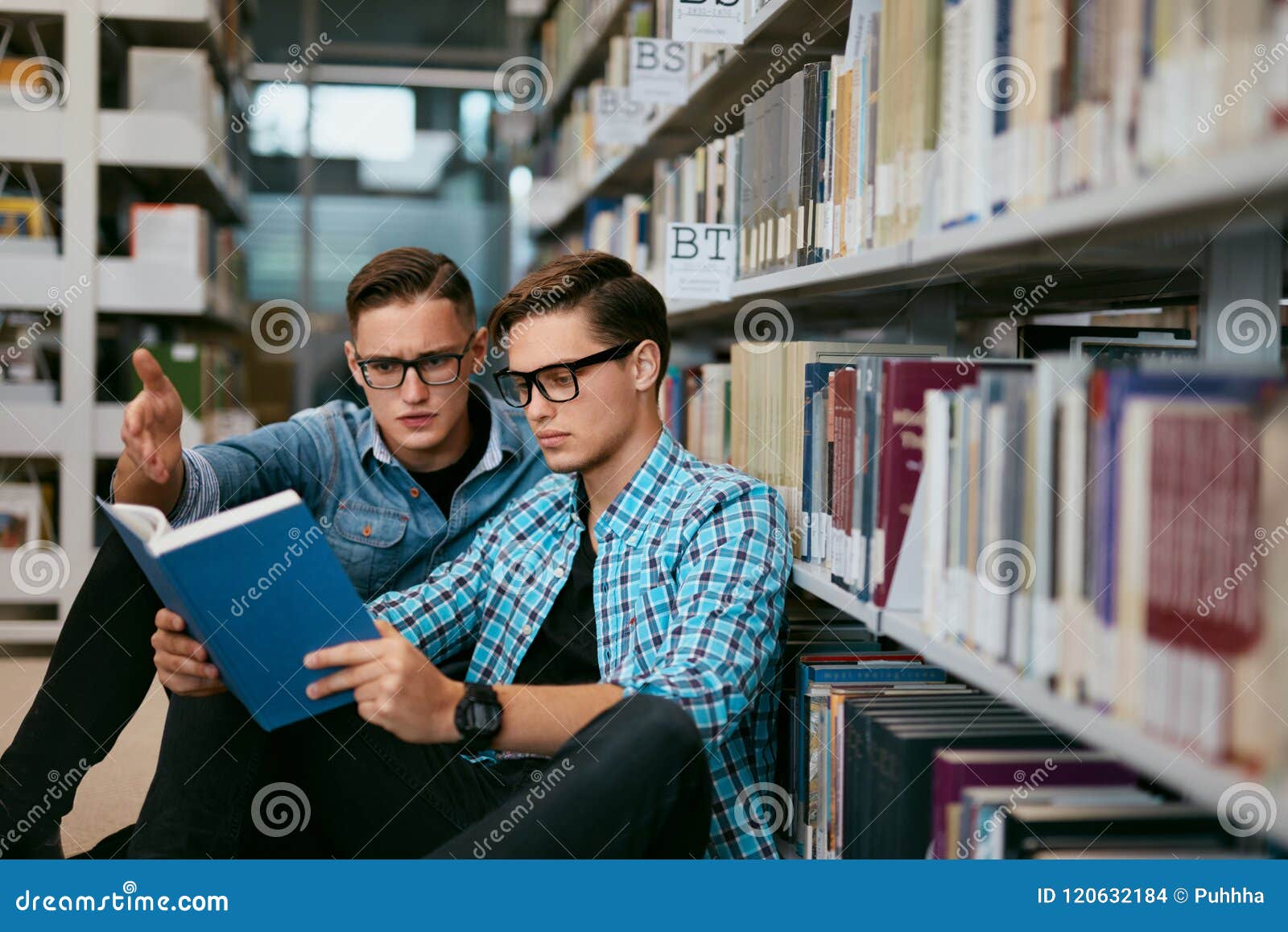 Students Learning Reading Book in University Library Stock Photo ...