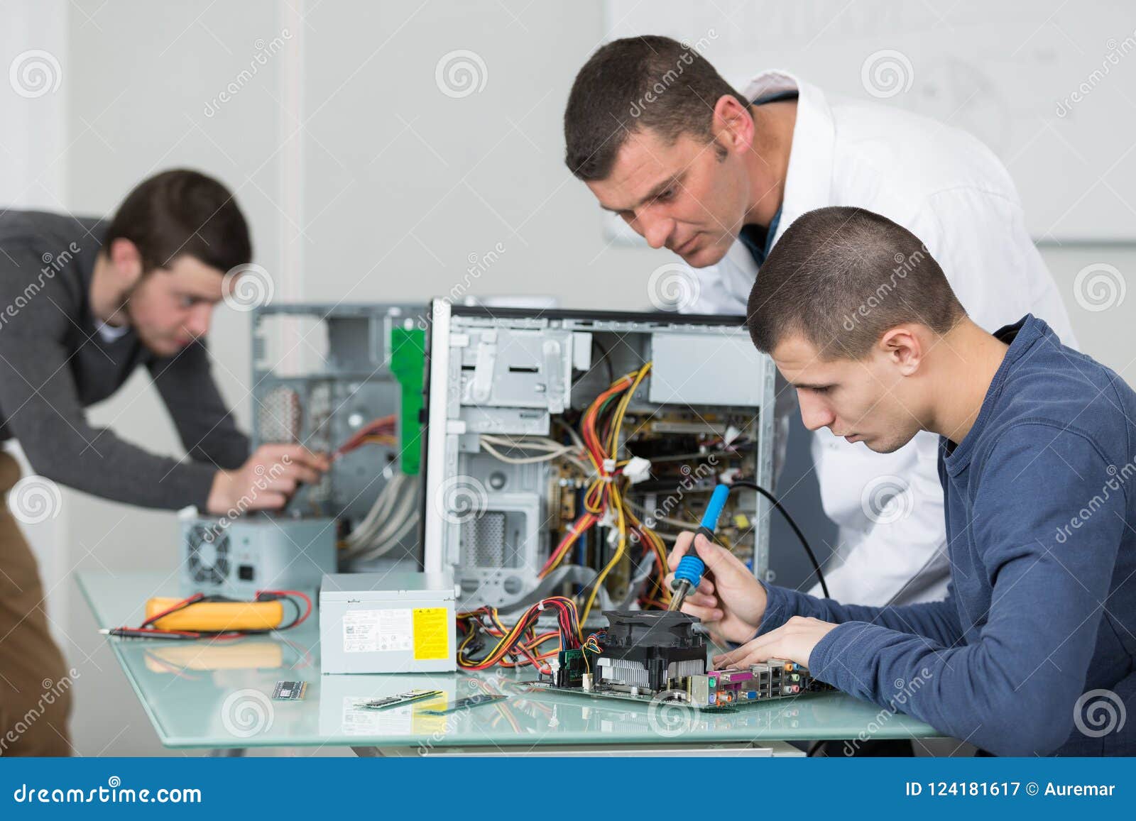 Students Learning To Solder Computer Components Stock Image - Image of ...