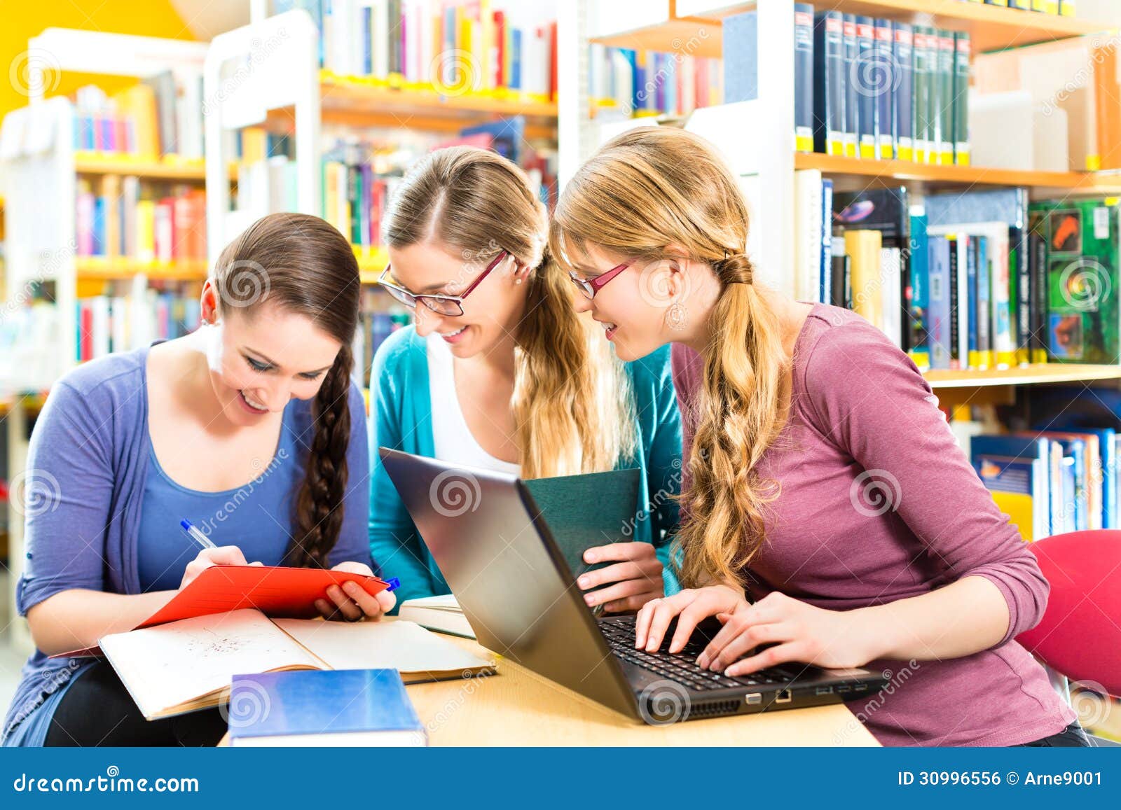 Students in Library are a Learning Group Stock Photo - Image of books ...
