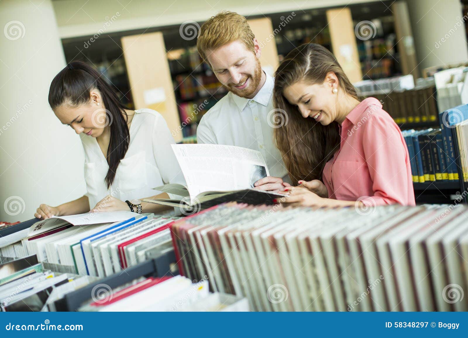 Students in the library stock image. Image of education - 58348297