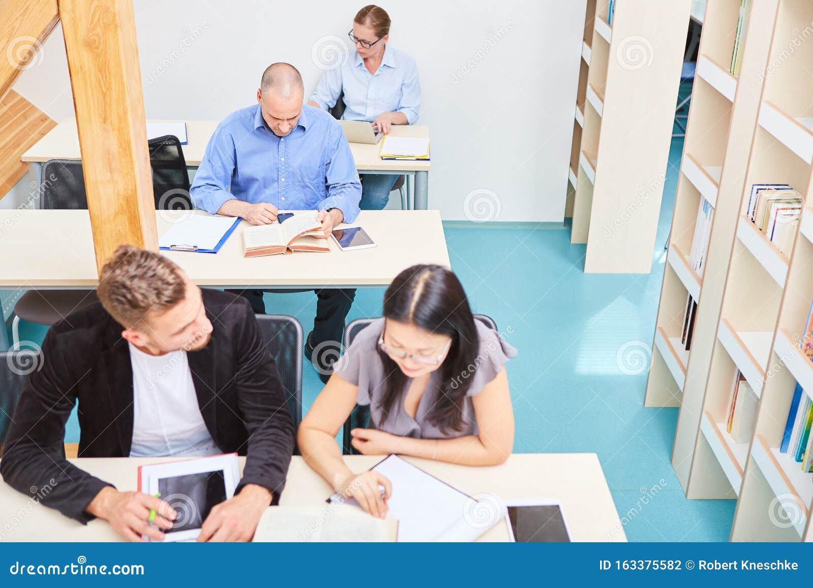 Students in a Library or Seminar Stock Photo - Image of computer ...