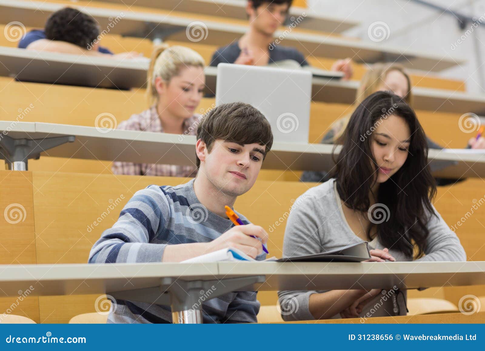 Students Listening and Taking Notes in a Lecture Stock Photo - Image of ...