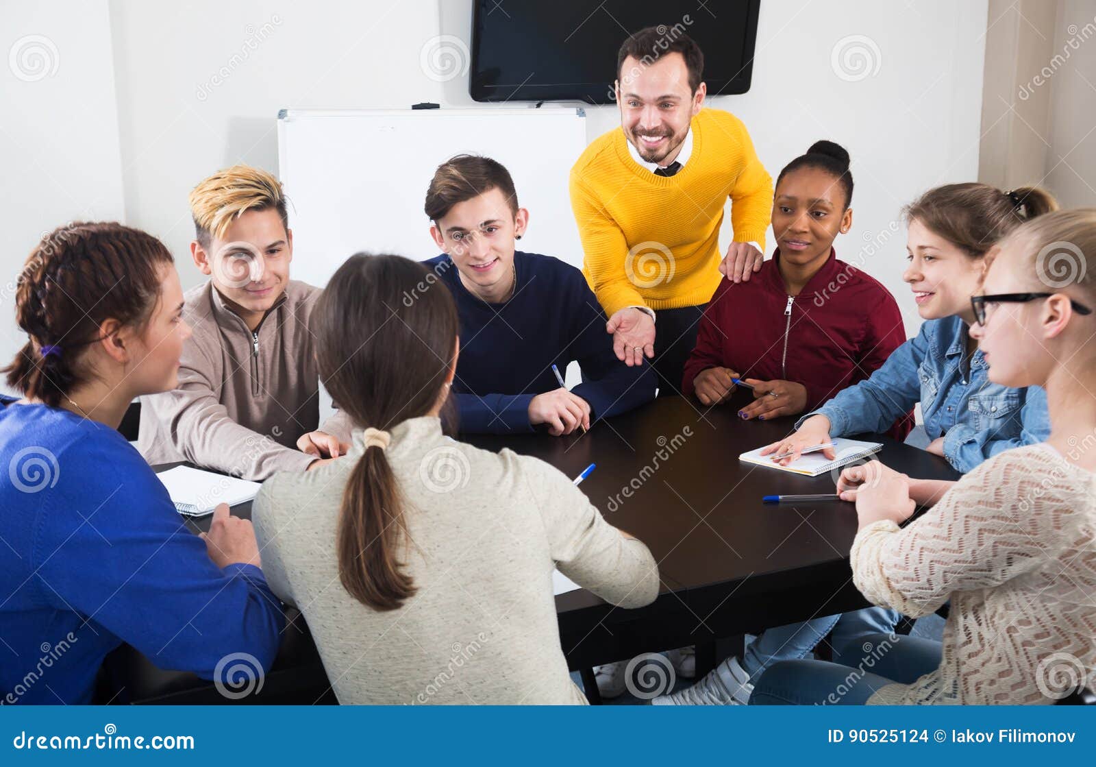 Students Listening To Teacher Stock Photo - Image of desks, credit ...