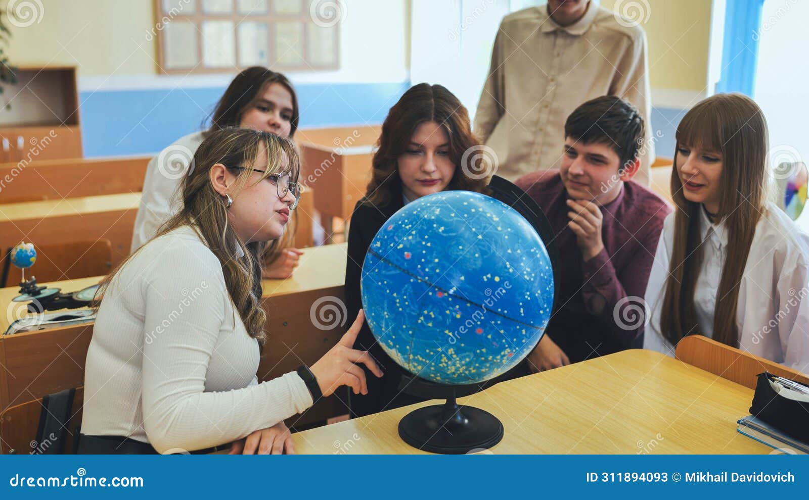 Students Look at a Globe of the Starry Sky in a Classroom at School ...