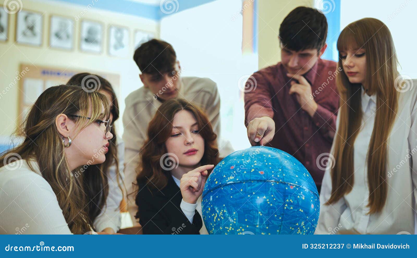 Students Look at a Globe of the Starry Sky in a Classroom at School ...