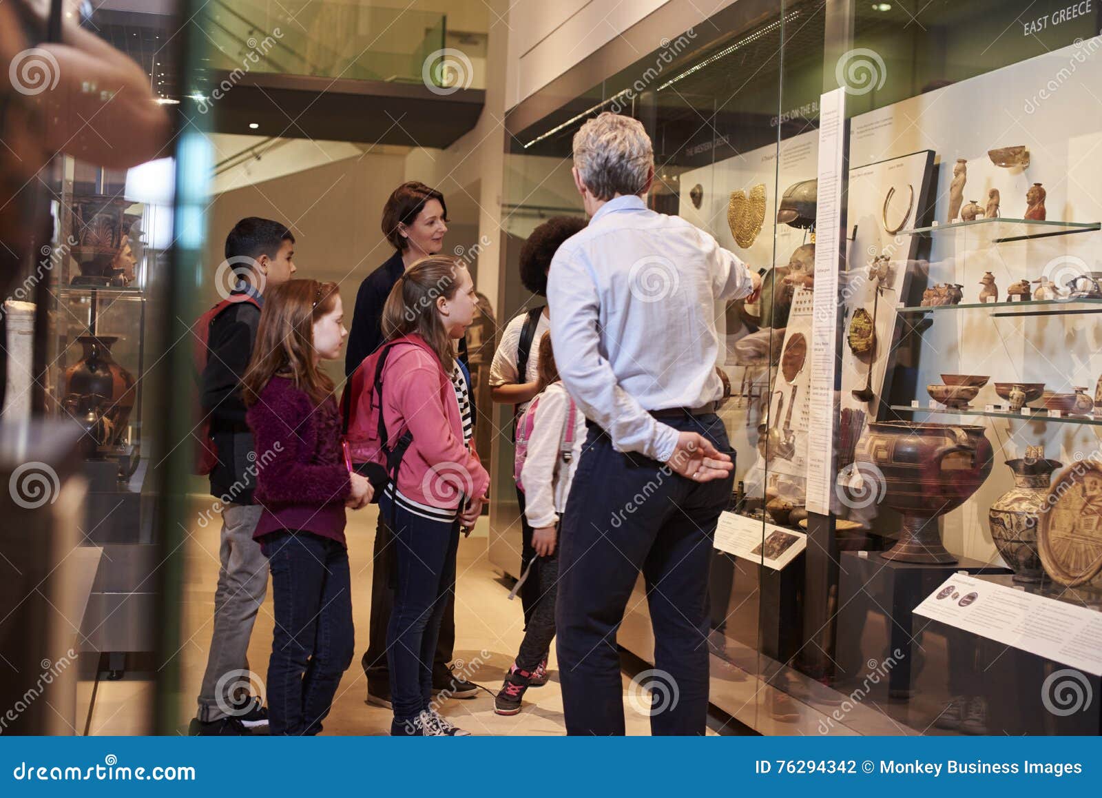 Students Looking at Artifacts in Case on Trip To Museum Editorial ...