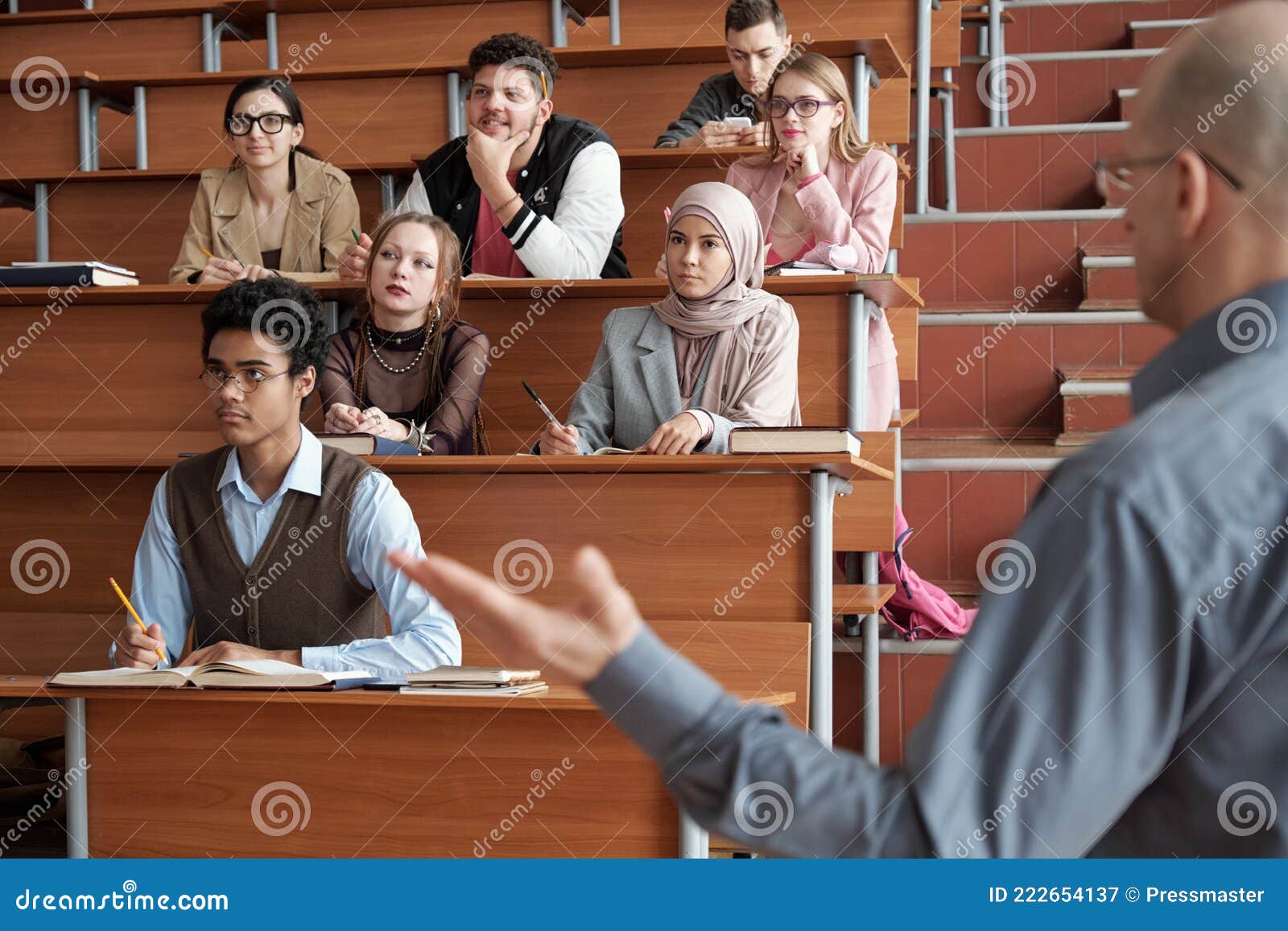 Students Looking at Blackboard while Teacher Explaining Something Stock ...