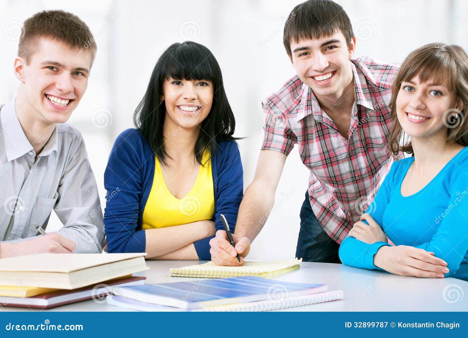 Students looking at camera stock image. Image of desk - 32899787