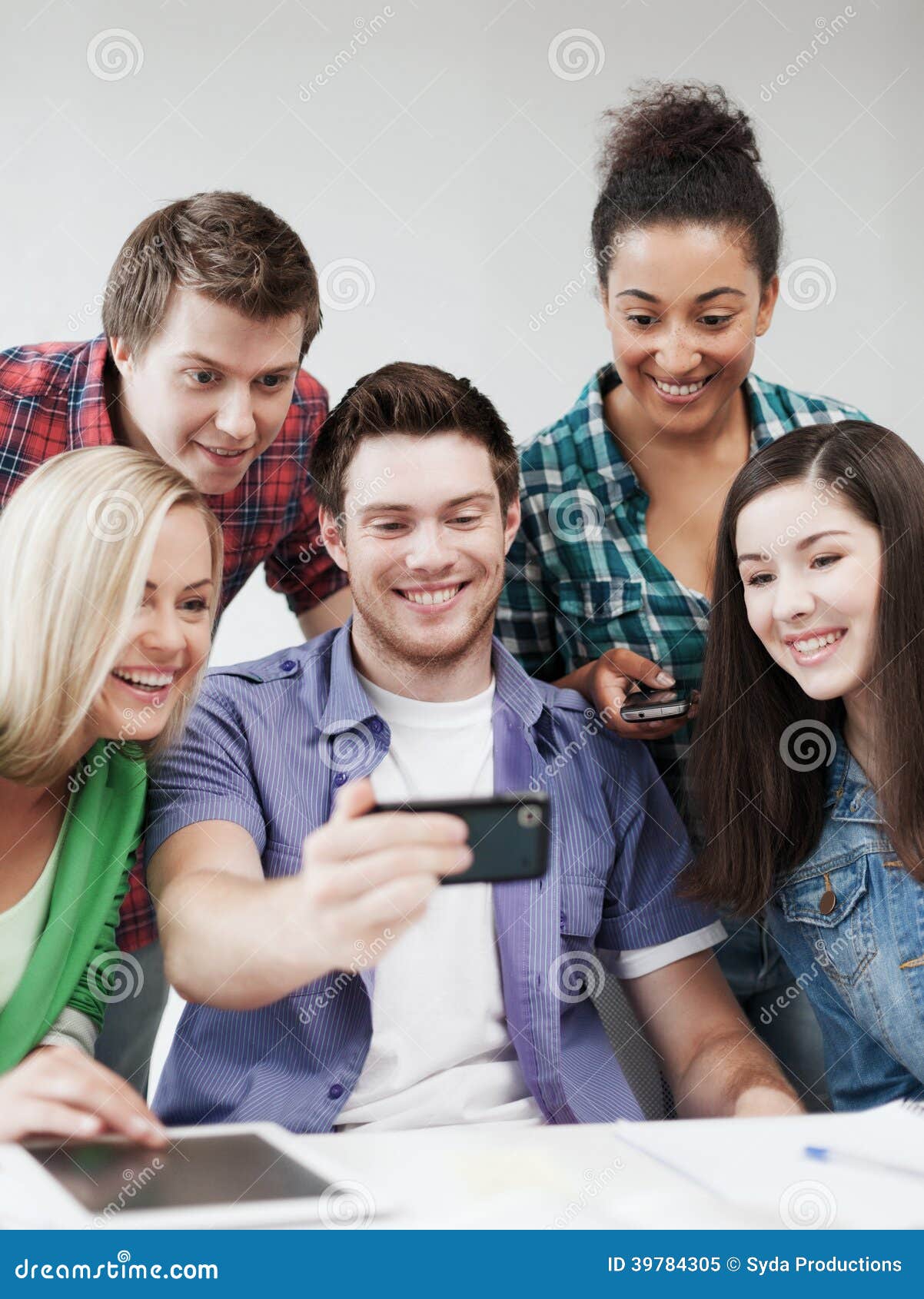 Students Looking into Smartphone at School Stock Image - Image of ...