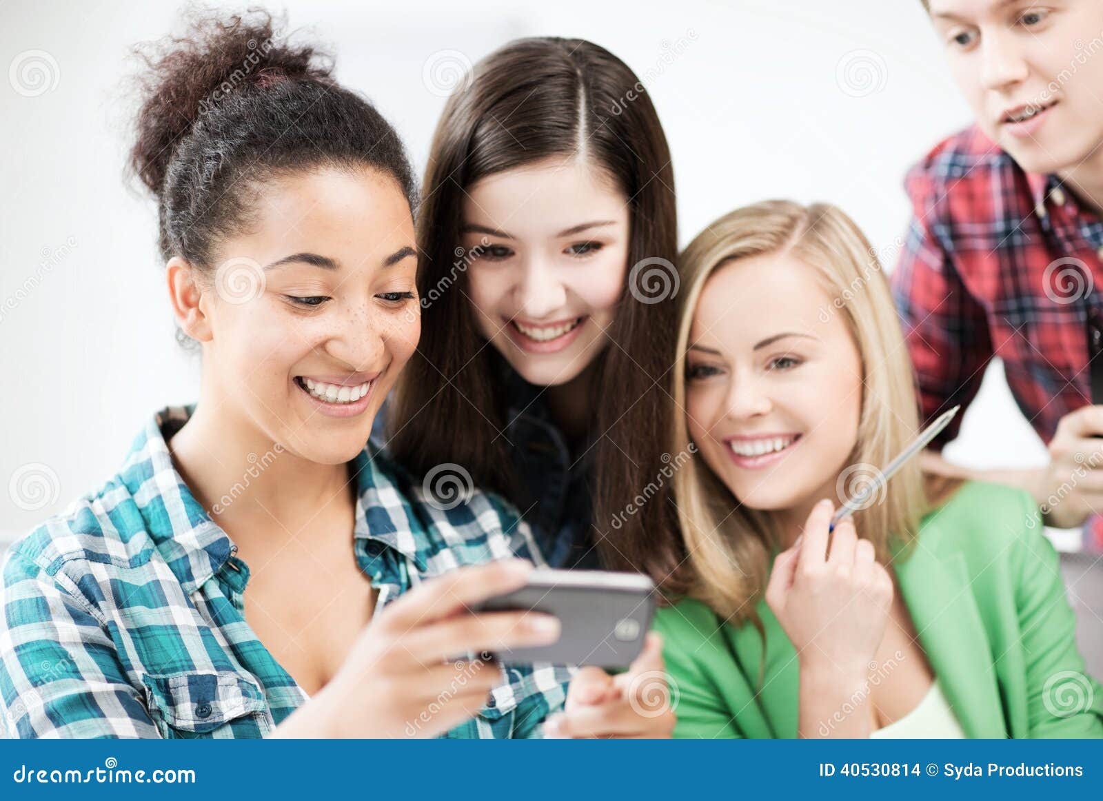 Students Looking at Smartphone at School Stock Photo - Image of ...