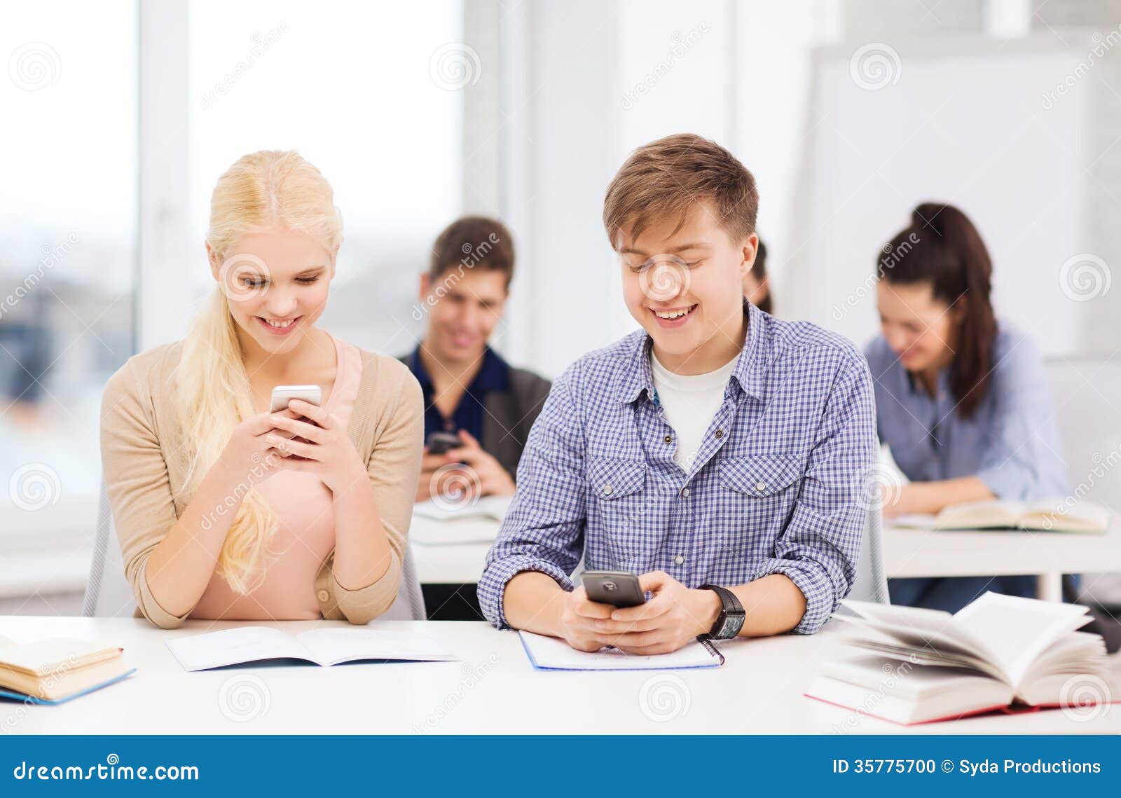 Students Looking into Smartphone at School Stock Photo - Image of group ...