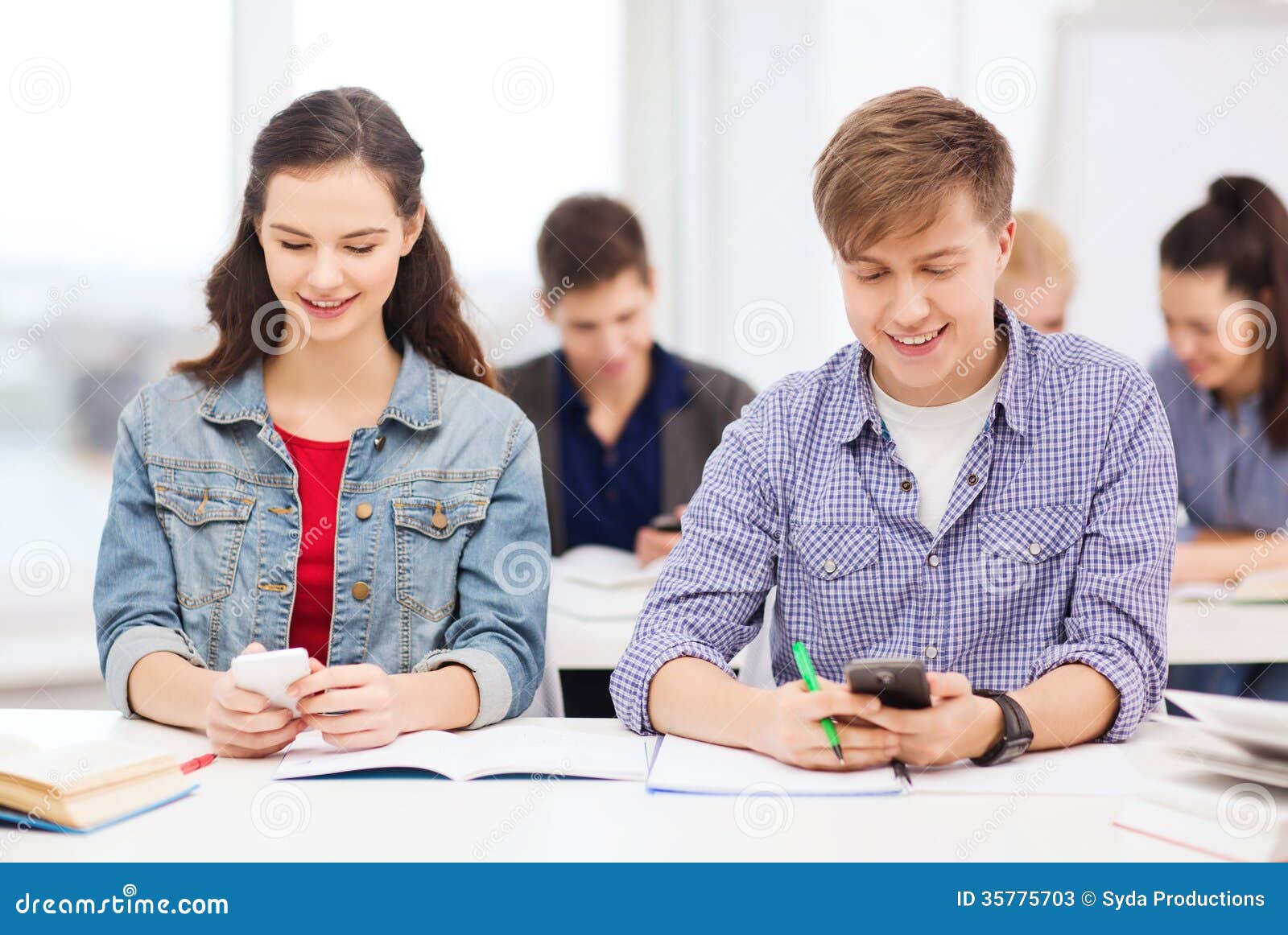 Students Looking into Smartphone at School Stock Image - Image of ...