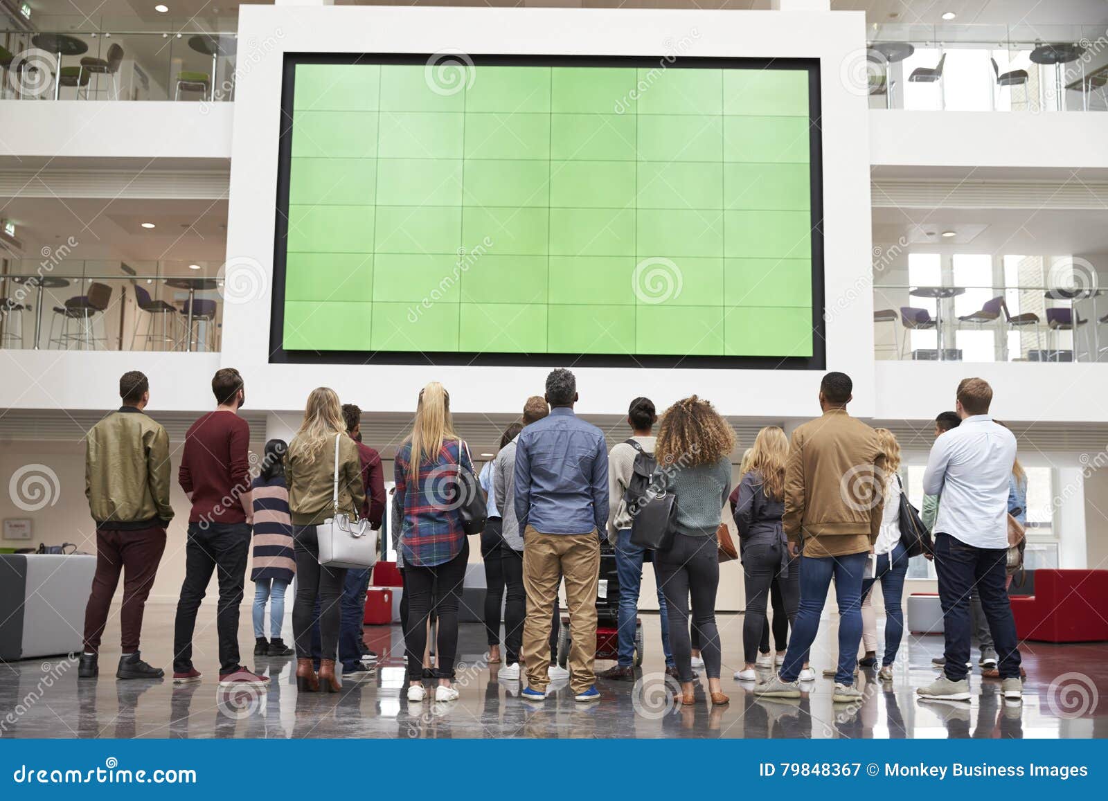 Students Looking Up at a Big Screen in University Building Stock Image ...
