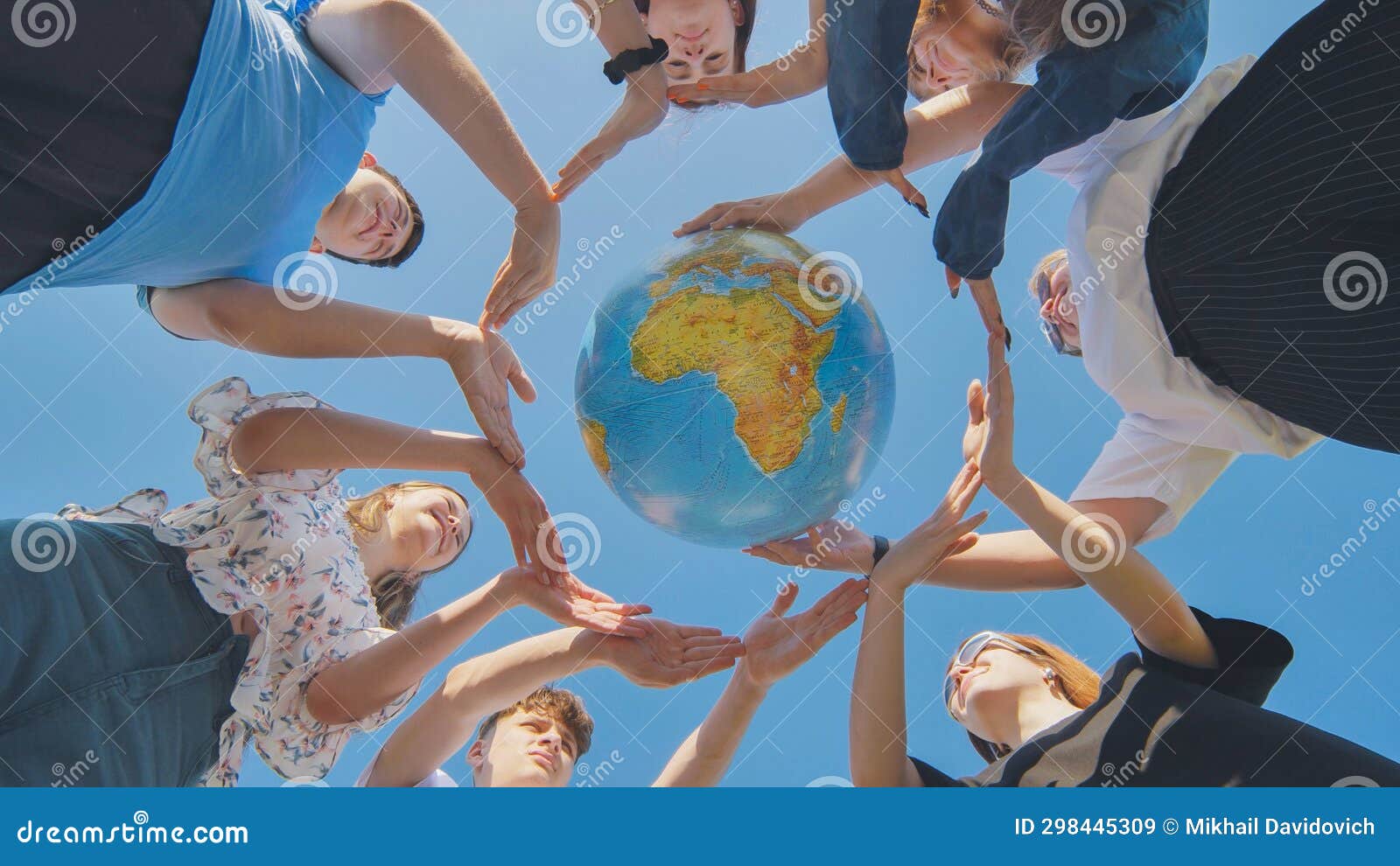 Students Make a Circle Around the Globe of the World. the Concept of ...