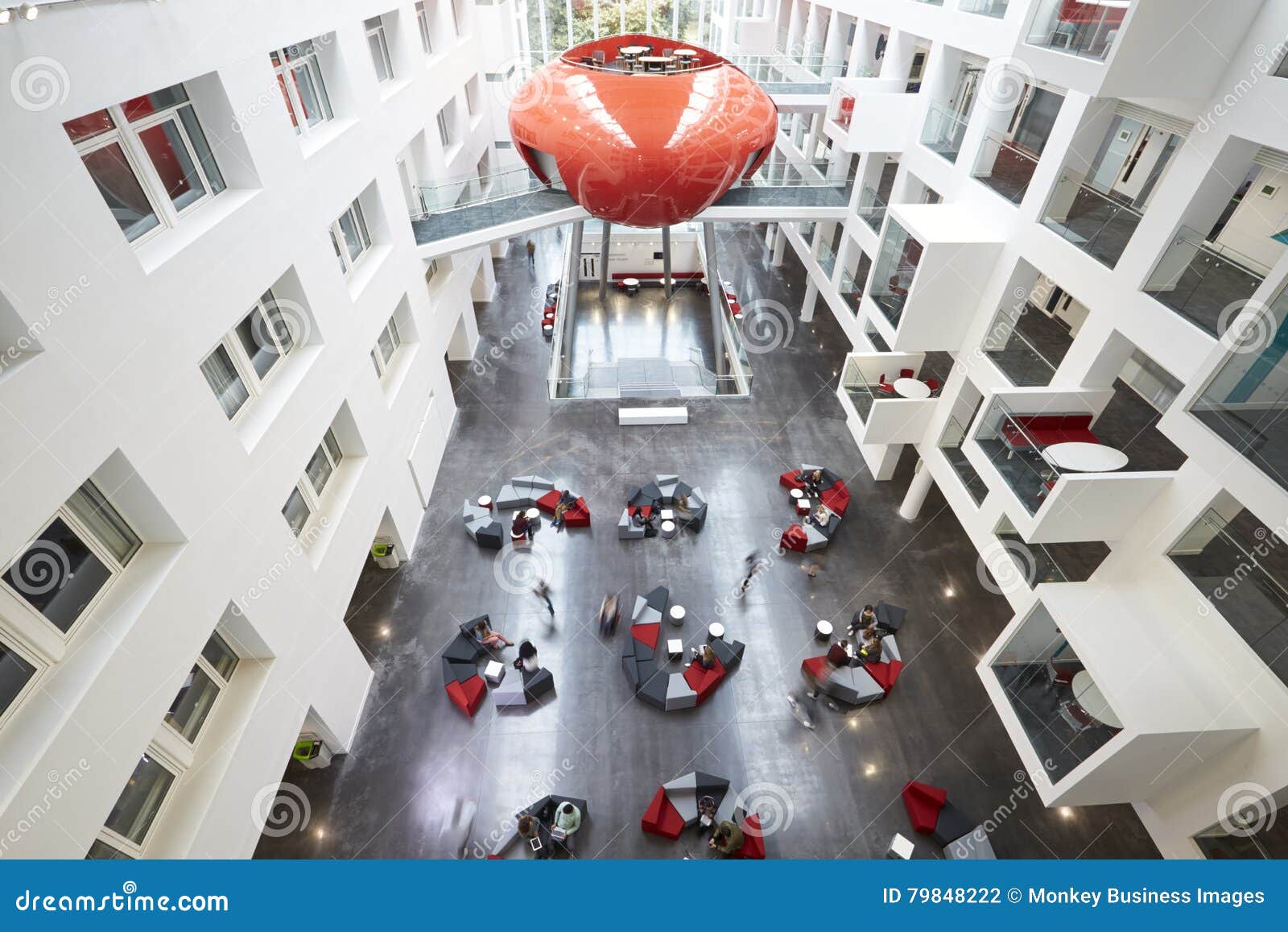 Students Moving Around the Atrium Area of Modern University Stock Photo ...