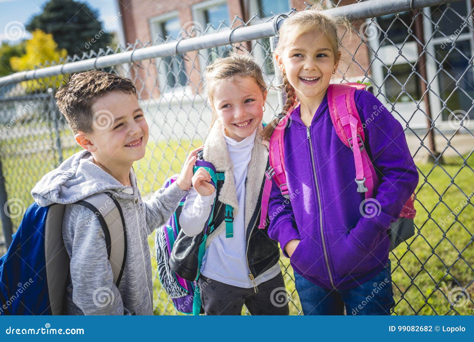 Students Outside School Standing Together Stock Photo - Image of group ...