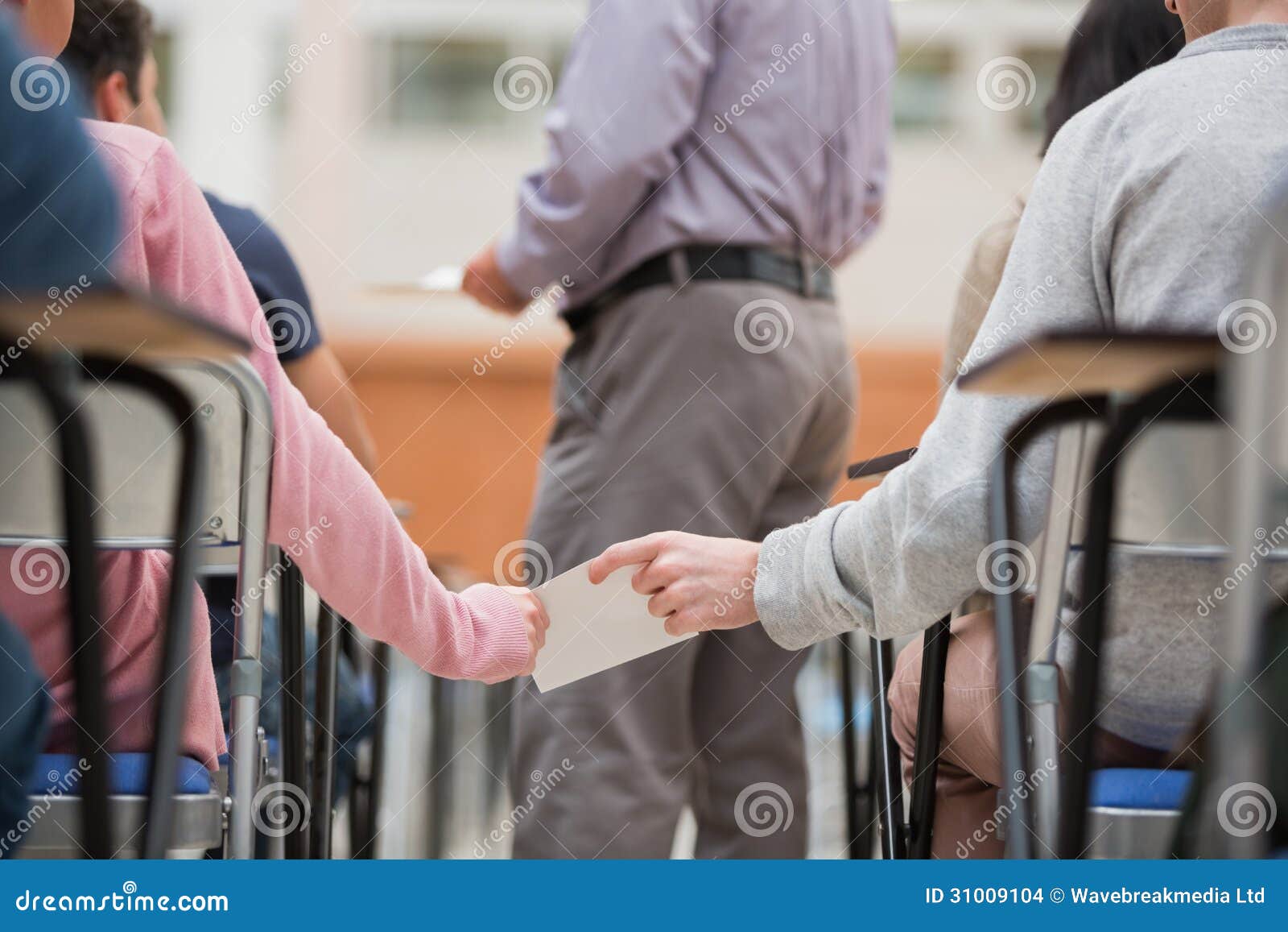 Students passing notes stock photo. Image of test, passing - 31009104