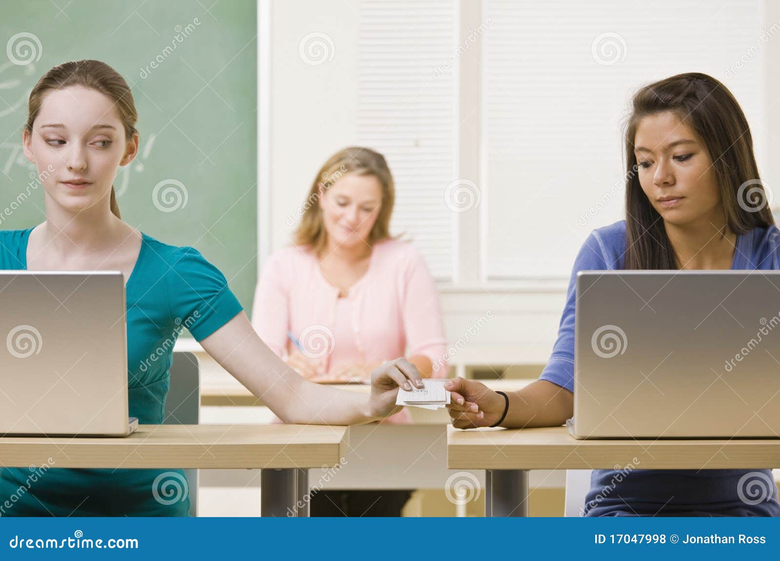 Students Passing Notes in Classroom Stock Photo - Image of classroom ...