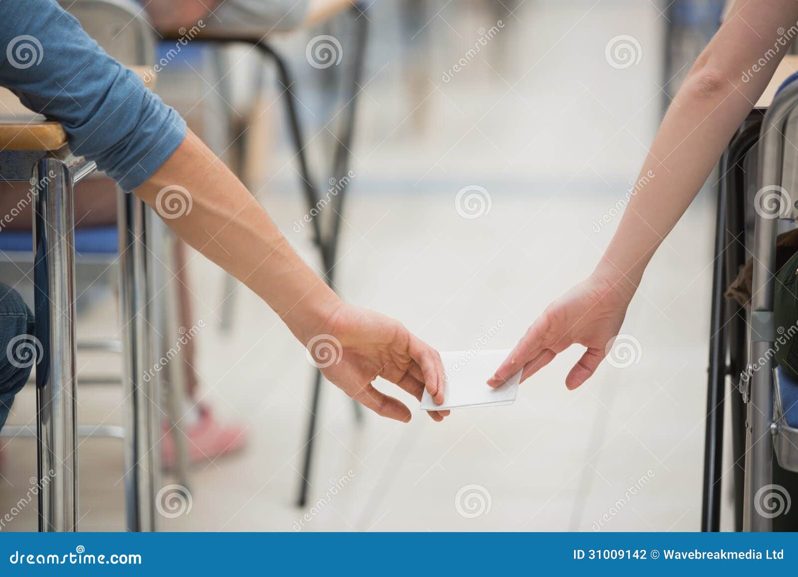 Students passing notes stock photo. Image of room, note - 31009142