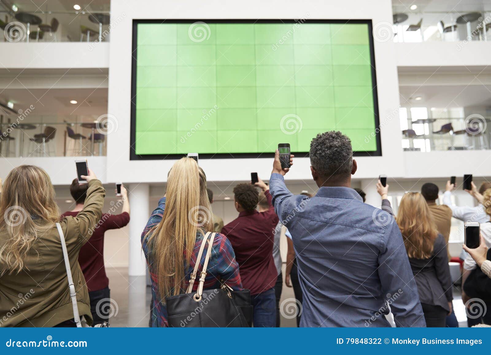 Students Photographing Big Screen with Phones, Back View Stock Photo ...